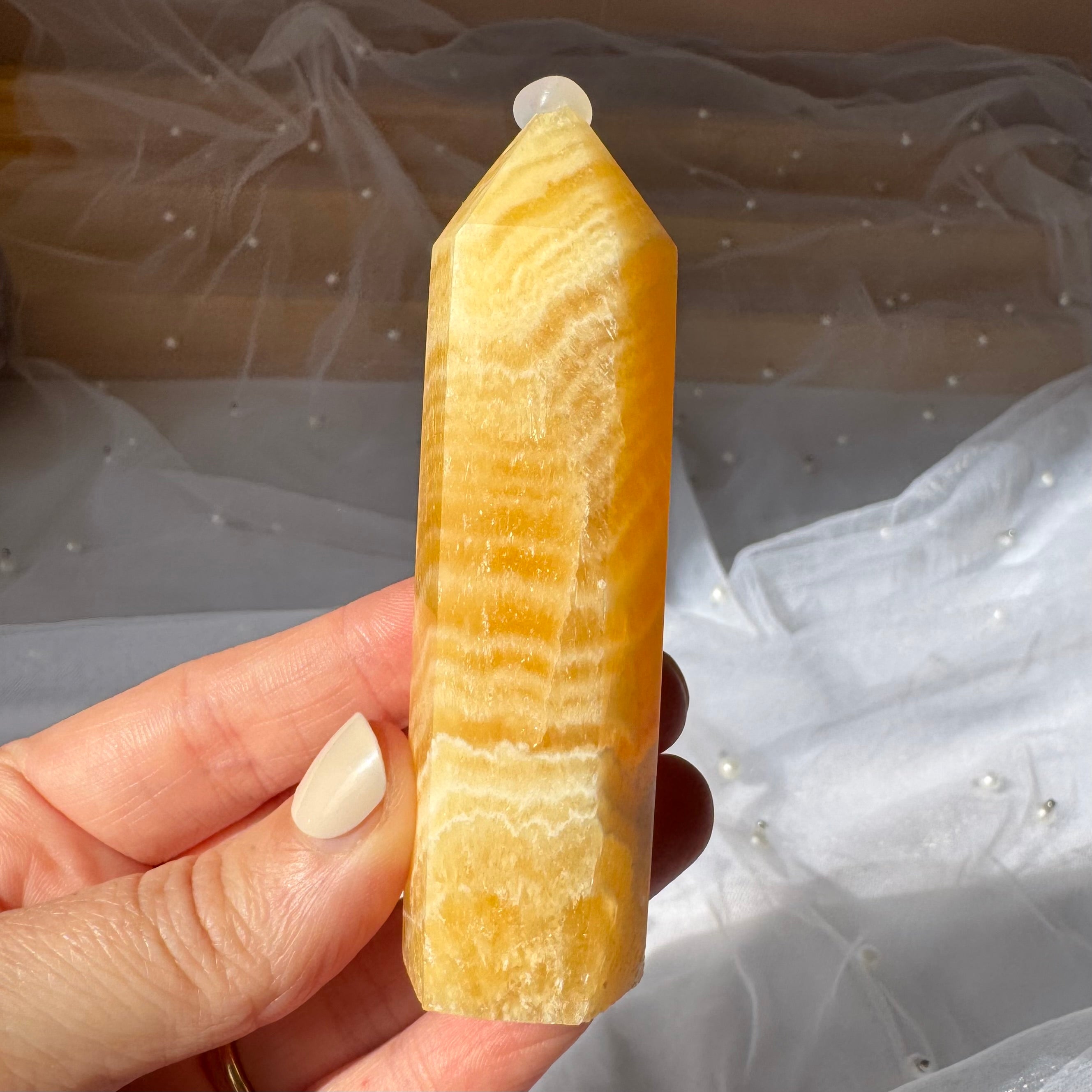 Orange Calcite Point (b) – Grounded Crystals